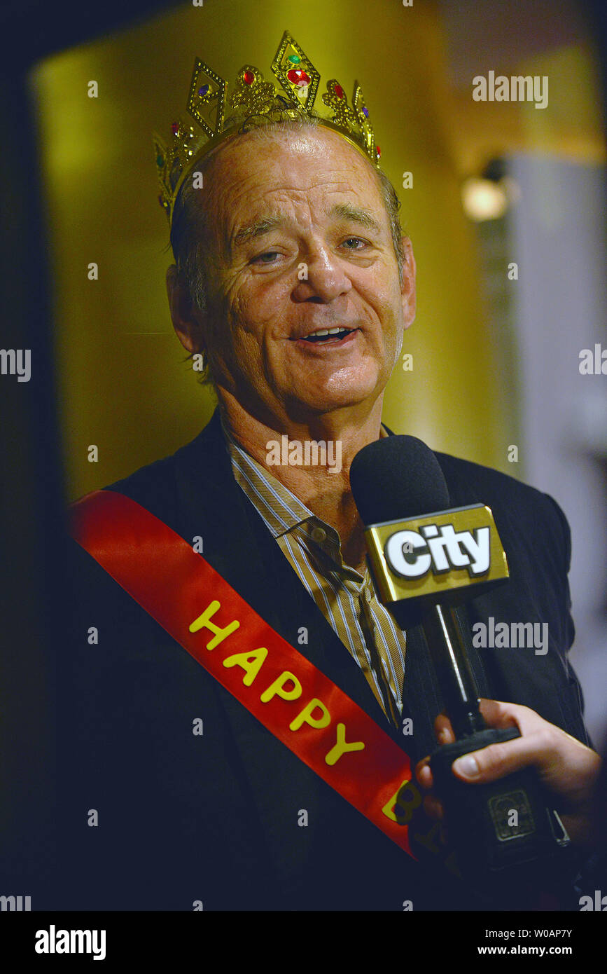 Bill Murray speaks with TV reporters as he arrives for the world ...