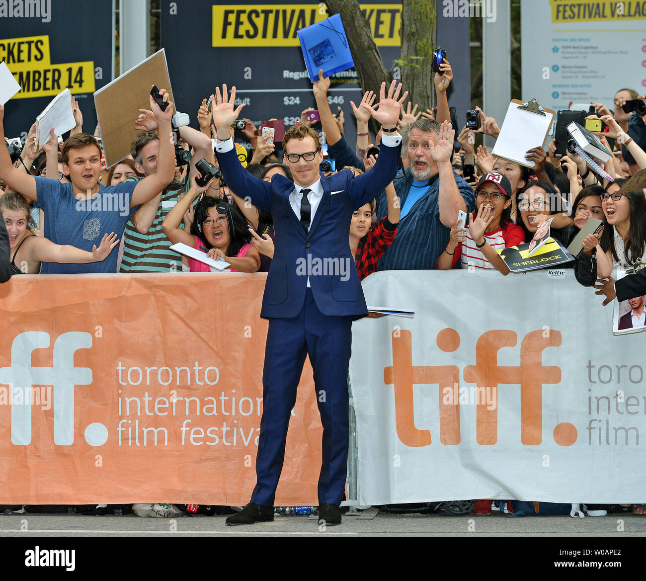 Benedict Cumberbatch poses with fans as he arrives for the Toronto ...