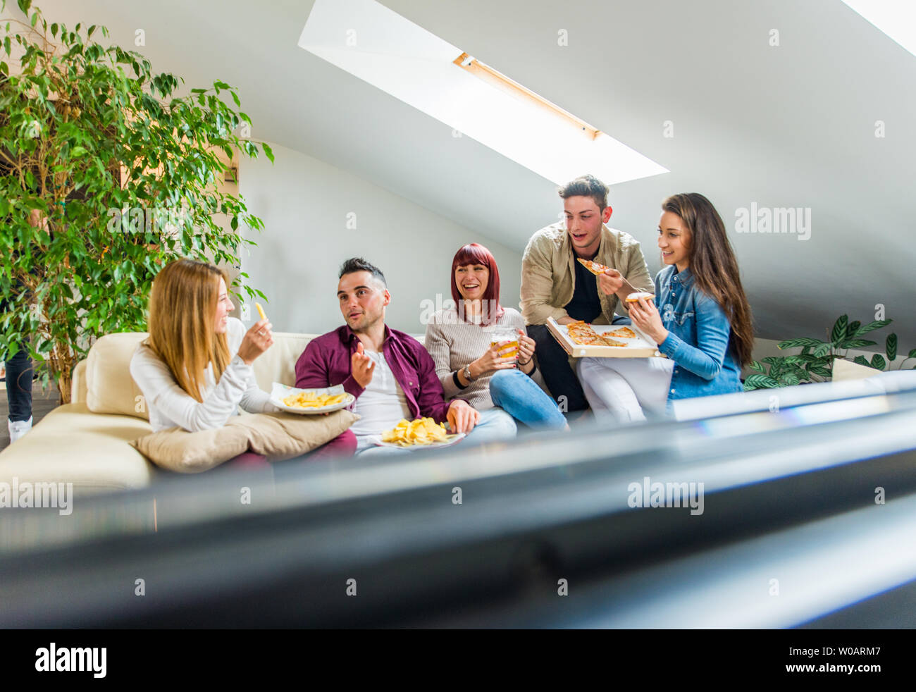Group of happy friends bonding at home - Young adults having party and ...