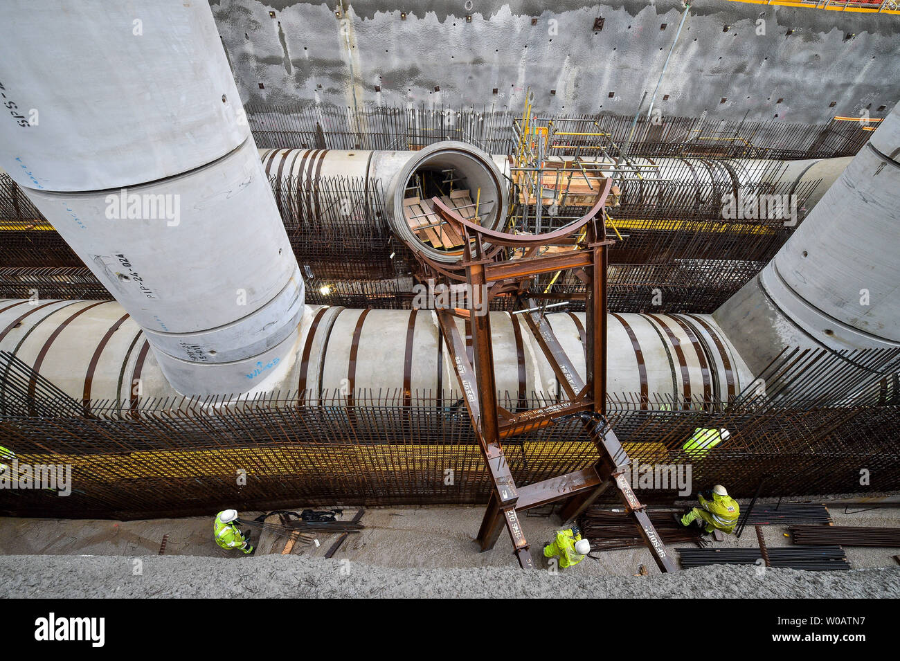 Workers inspect giant water cooling pipes hi-res stock photography and ...