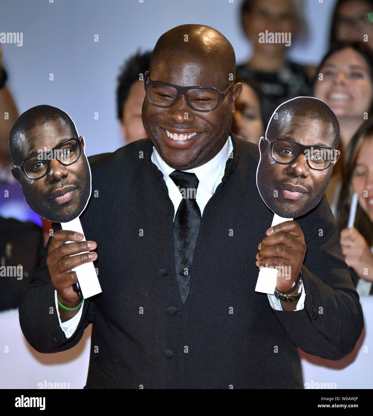 Director and co-screenwriter Steve McQueen poses with selfie sticks of ...