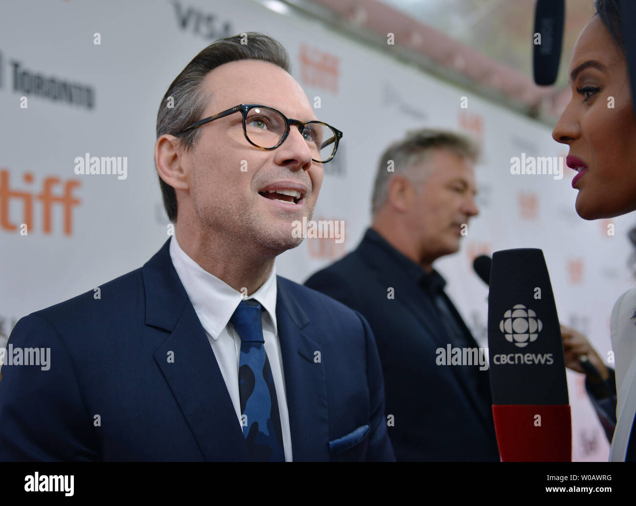 Christian Slater (L) and Alec Baldwin speak to television reporters on ...