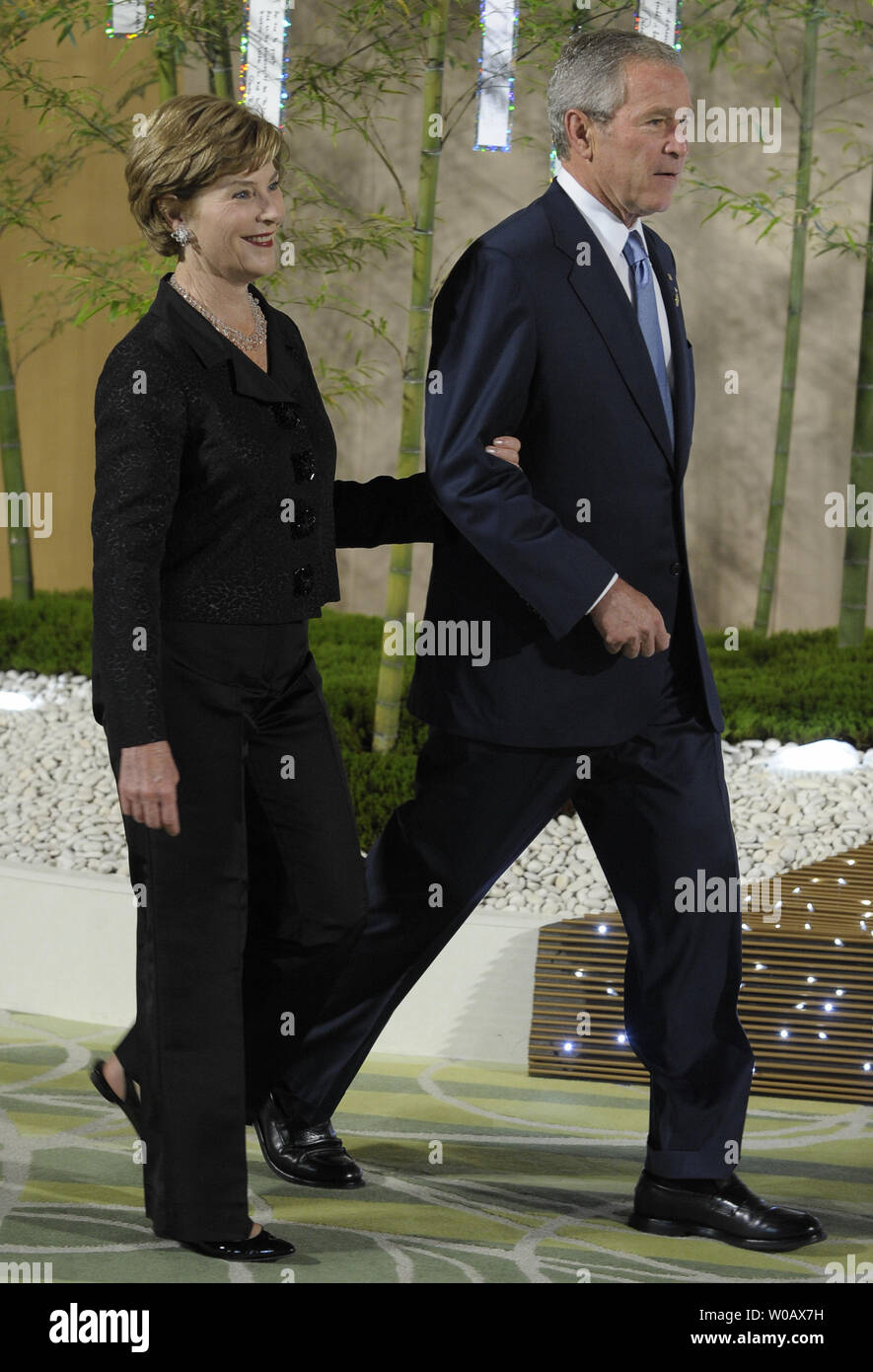 U.S. President George W. Bush and first lady Laura Bush arrive for a ...