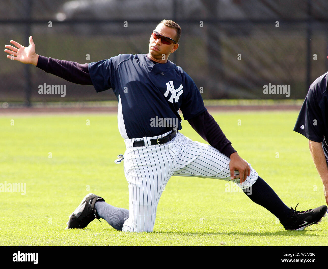 New York Yankees' Alex Rodriguez stretches during spring training ...