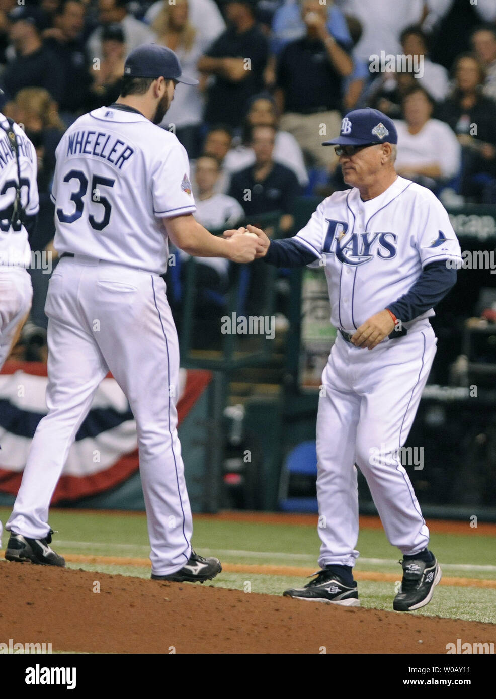 Tampa Bay Rays manager Joe Maddon takes out pitcher Dan Wheeler during ...