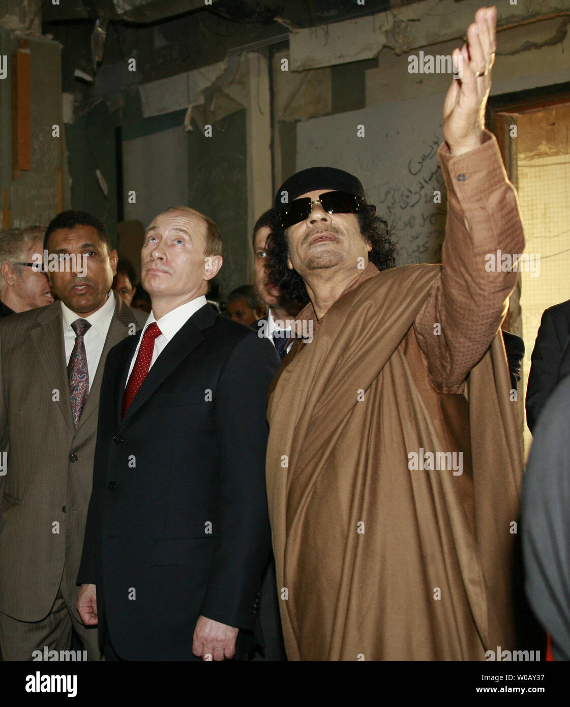 Libyan Leader Moammar Gadhafi (L) talks to Russian President Vladimir ...