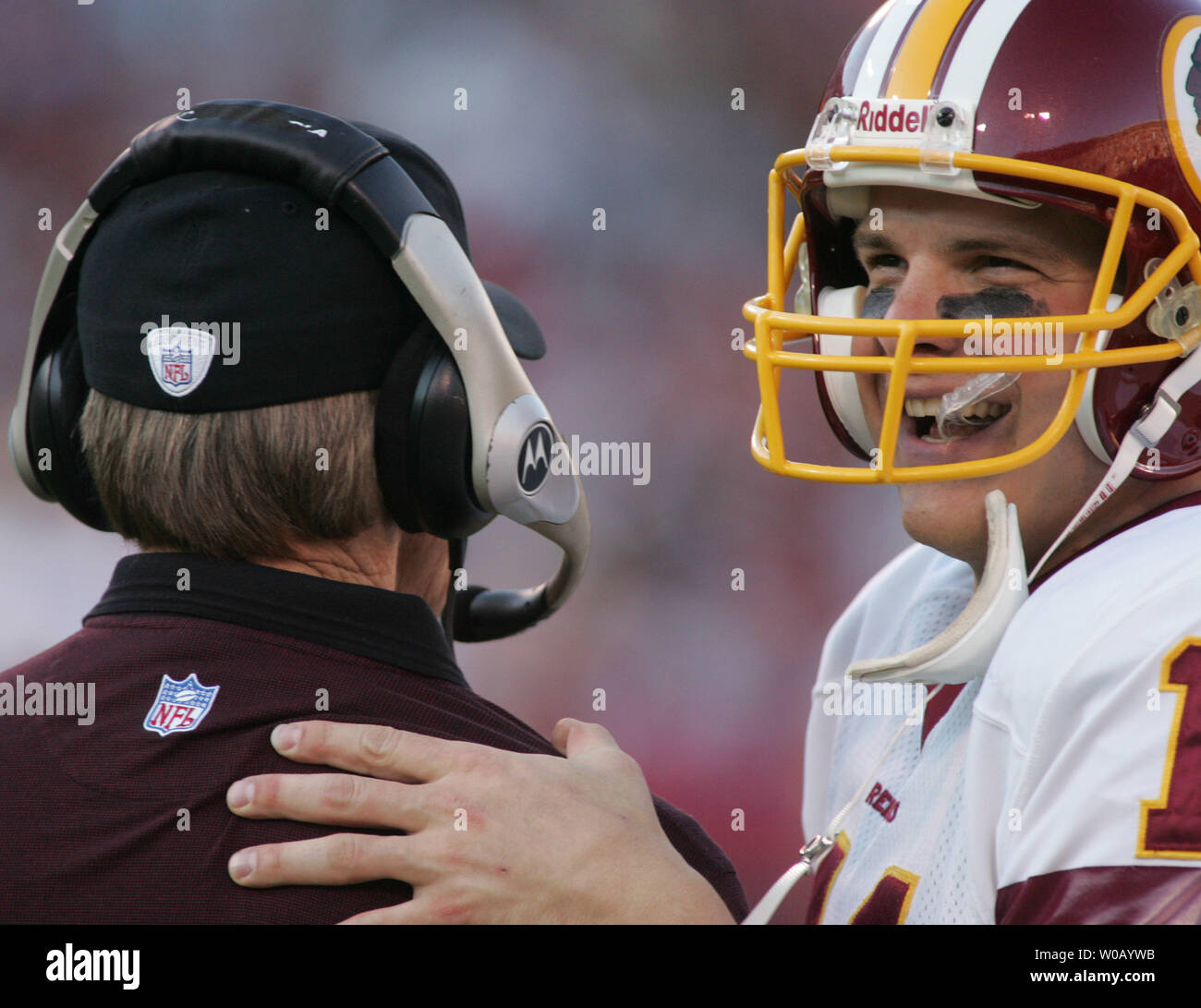 Washington Redskins Head Coach Joe Gibbs gets a pat on the back and a ...