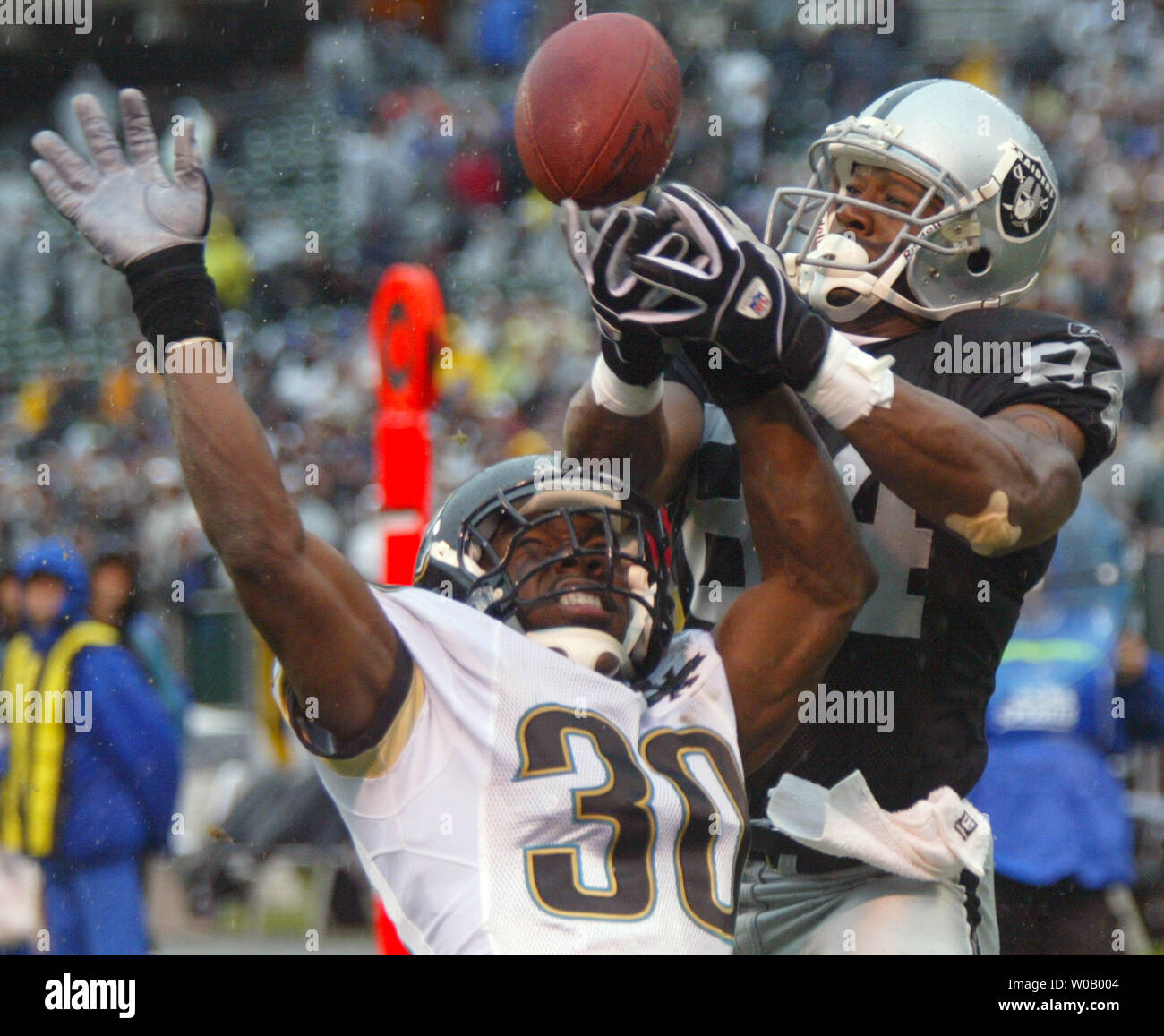 Jacksonville Jaguars' Dewayne Washington (30) breaks up a Kerry Collins ...