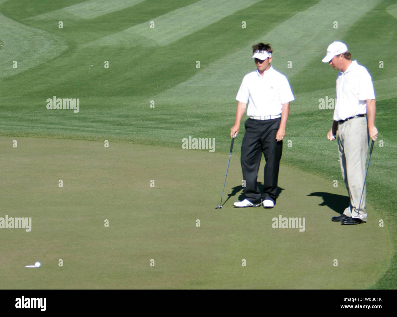 Jin Park left, and Mathias Gronberg watch Park's shot sit on the lip of ...