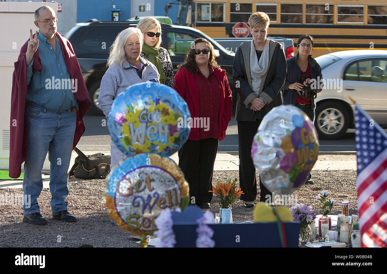 Mourners observe a national moment of silence at 9 A.M. MDT two days ...