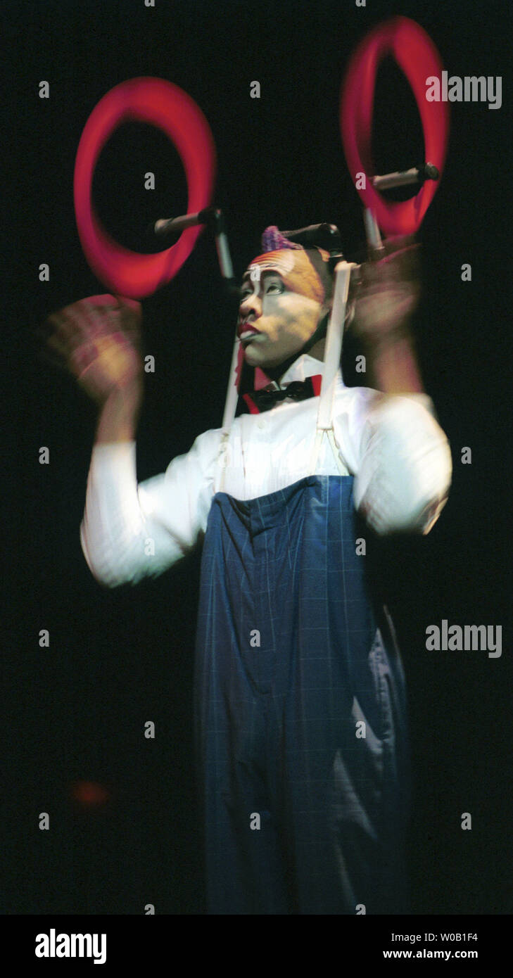 John the clown and emcee plays with hoops, entertaining a full house in ...