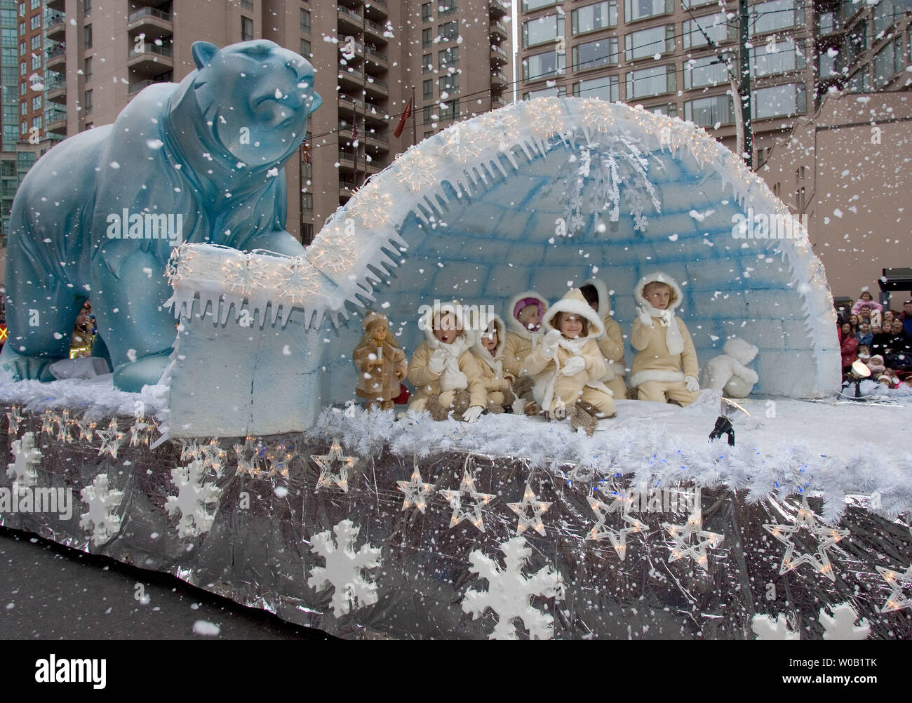 Polar bears, igloos and snow on a float representing the north pole ...