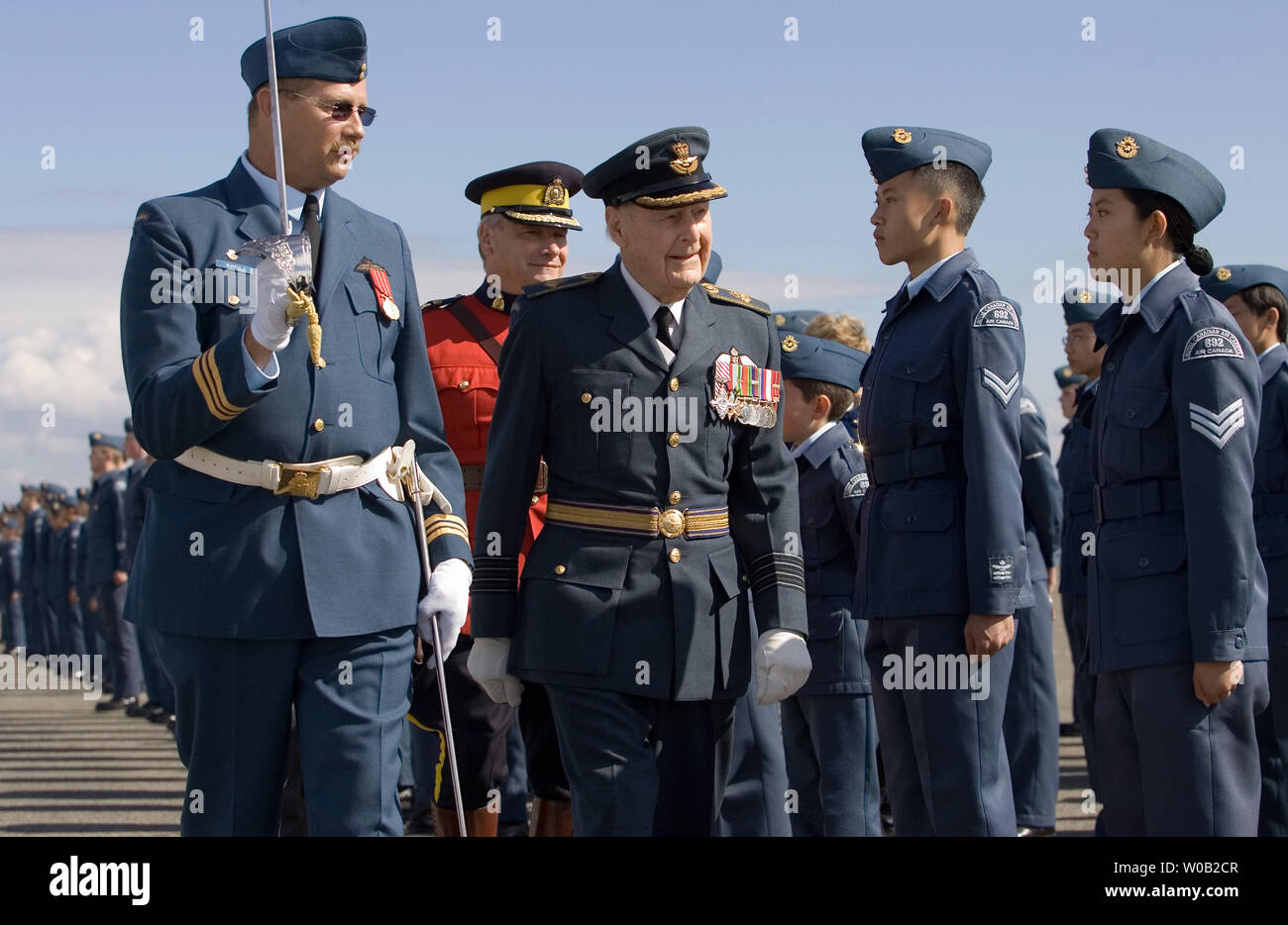 Escorted by Parade Commander Major Al Blakley (L) and RCMP Assistant ...