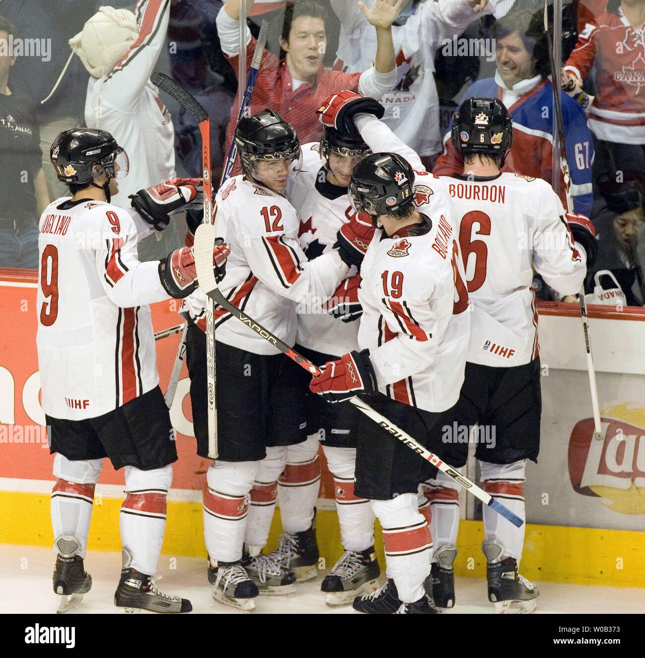 Team Canada's Andrew Cogliano (#9, assist), Kristopher Letang #12 ...