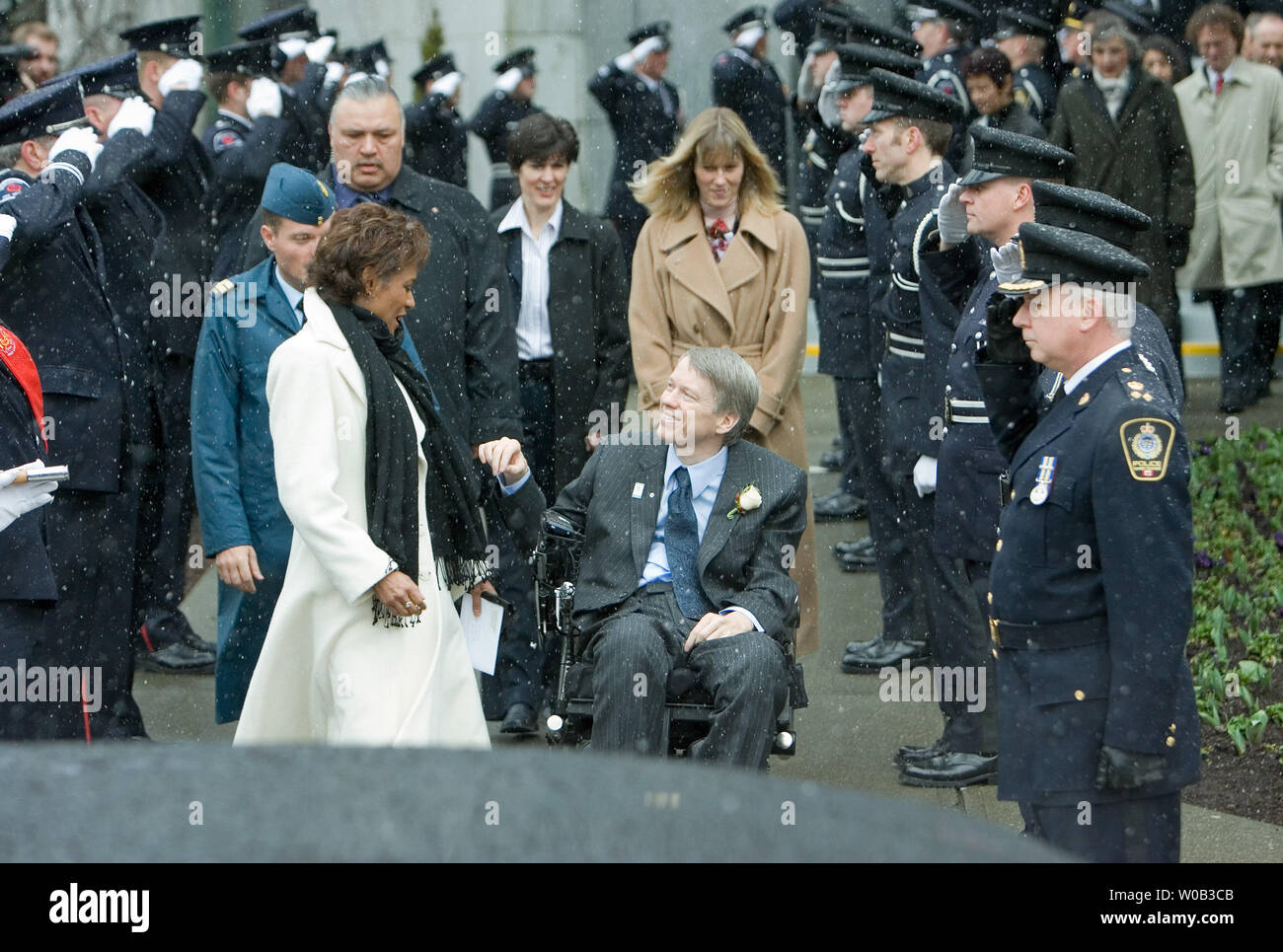 Canada's Governor General Michaelle Jean is escorted to her car by Mayor Sam Sullivan after ...