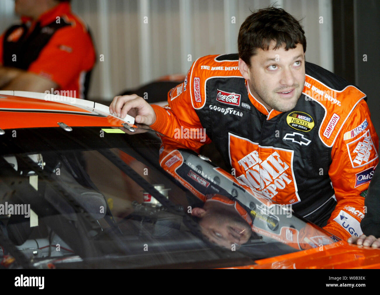 NASCAR race car driver Tony Stewart looks out of his garage as he ...