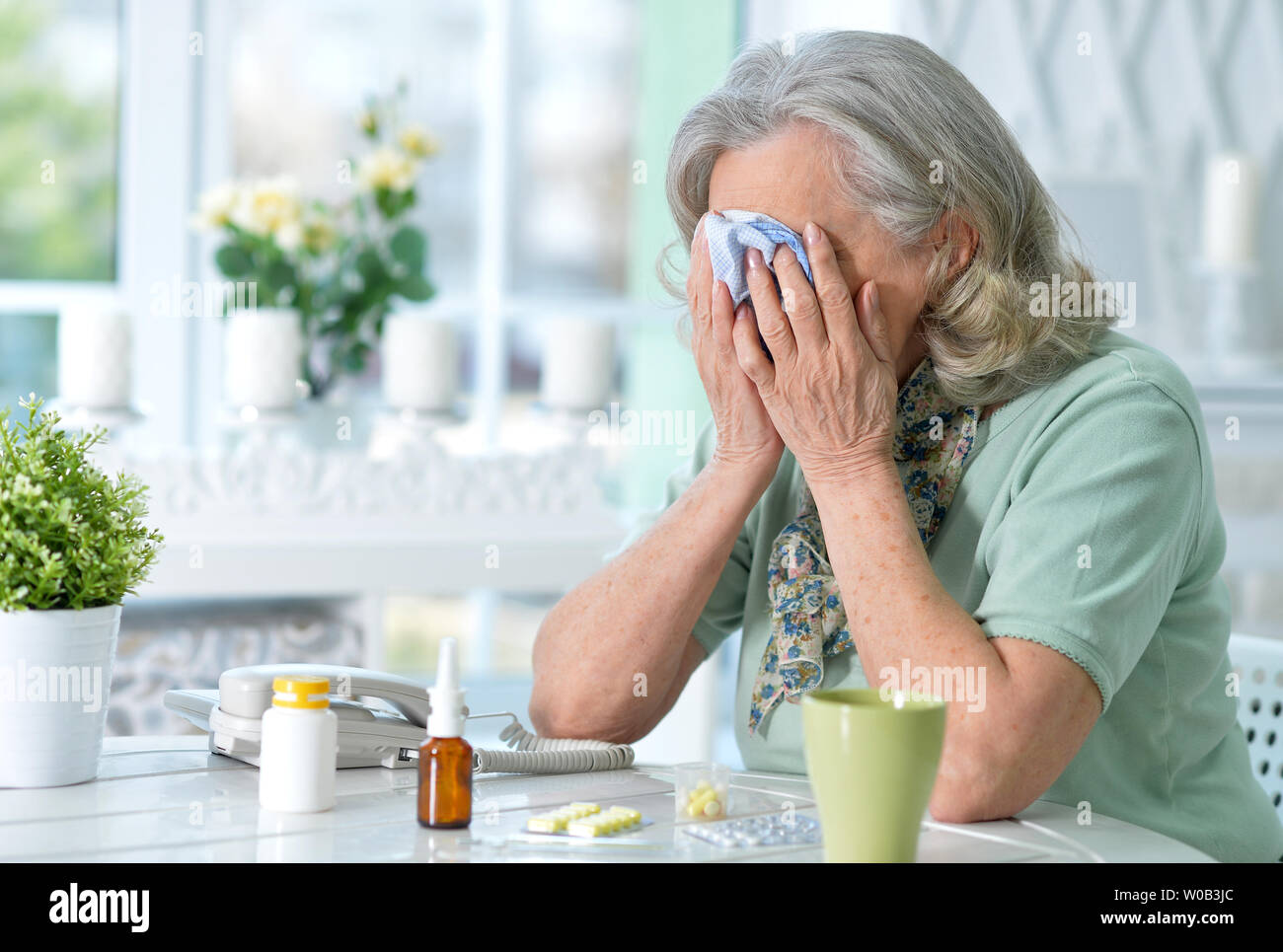 Caucasian sick woman aged sitting hi-res stock photography and images ...