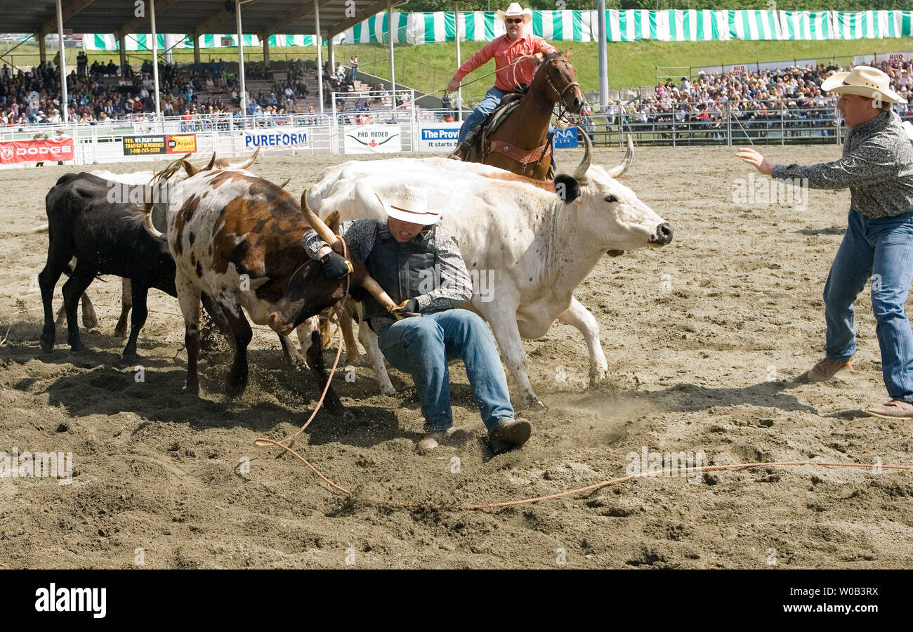 Rodeo cowboy holds on hi-res stock photography and images - Alamy