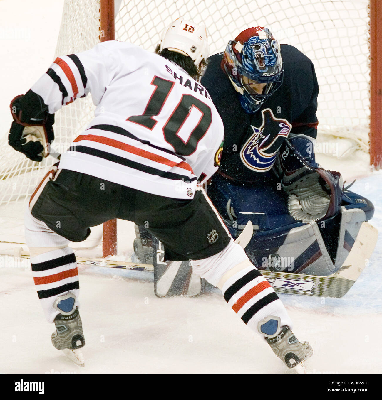 Vancouver Canucks goalie Roberto Luongo makes a save against Chicago ...