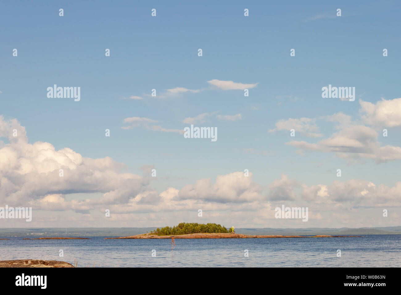 Sea trip by motor boat to rocky Kiy island on the White Sea of Russia ...
