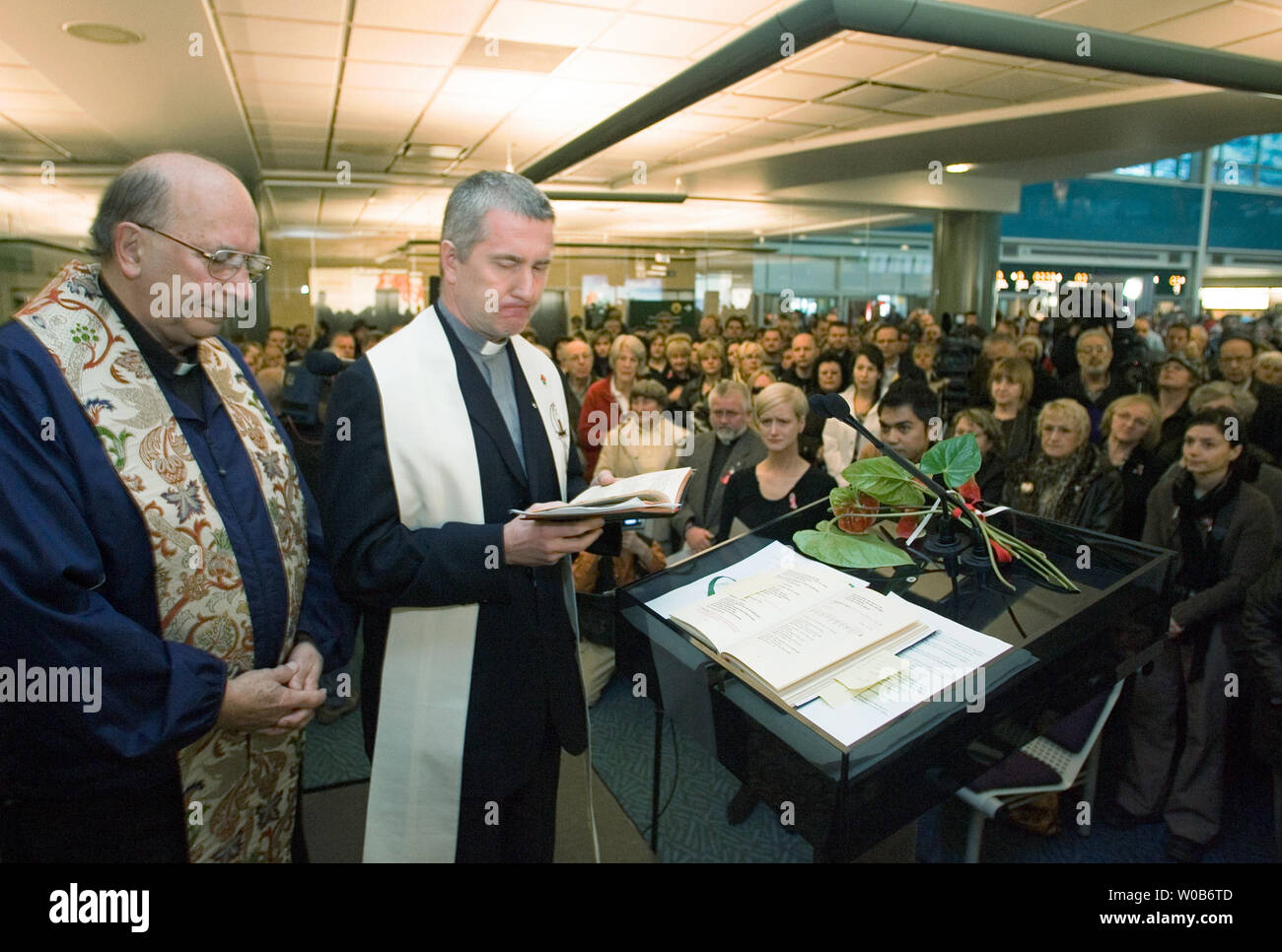 Reverand Angelo de Pompa (L) and Pastor Jacek Nosowicz speak at a ...