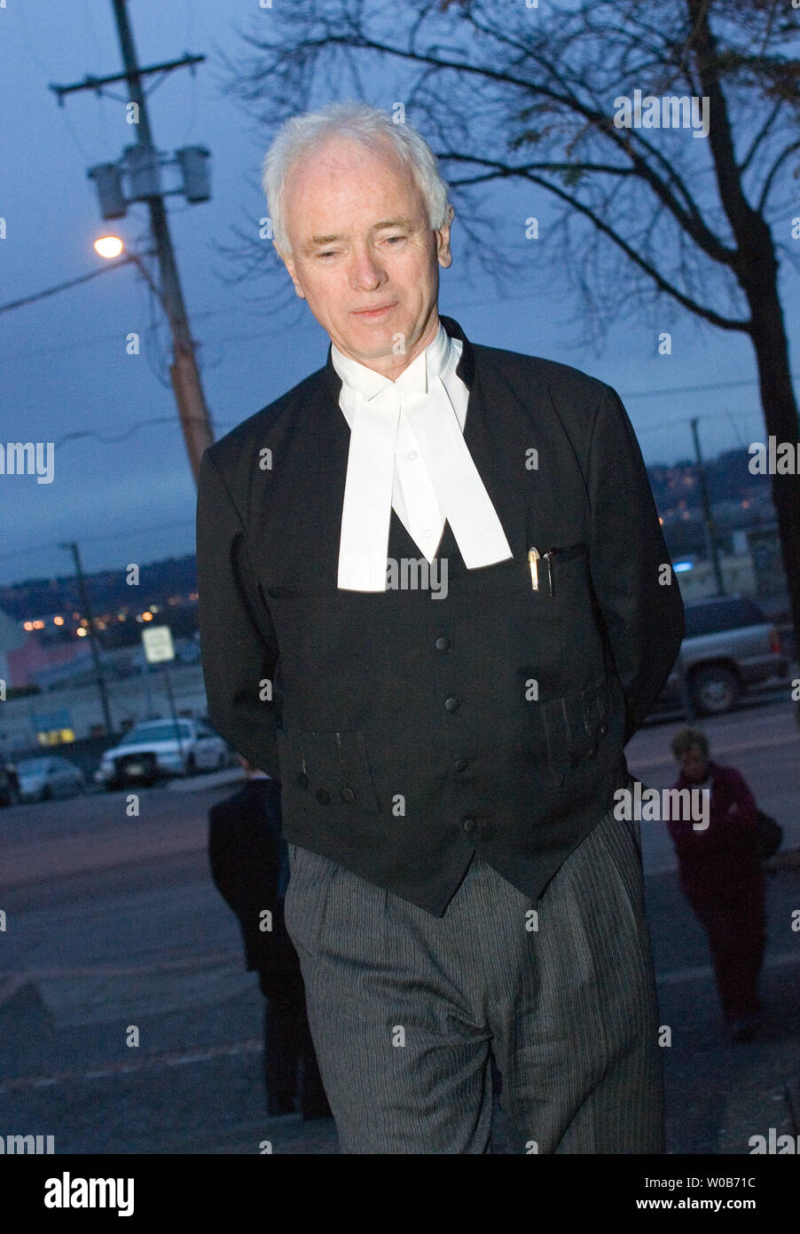 Lead defense lawyer Peter Ritchie goes for a short walk during a break ...