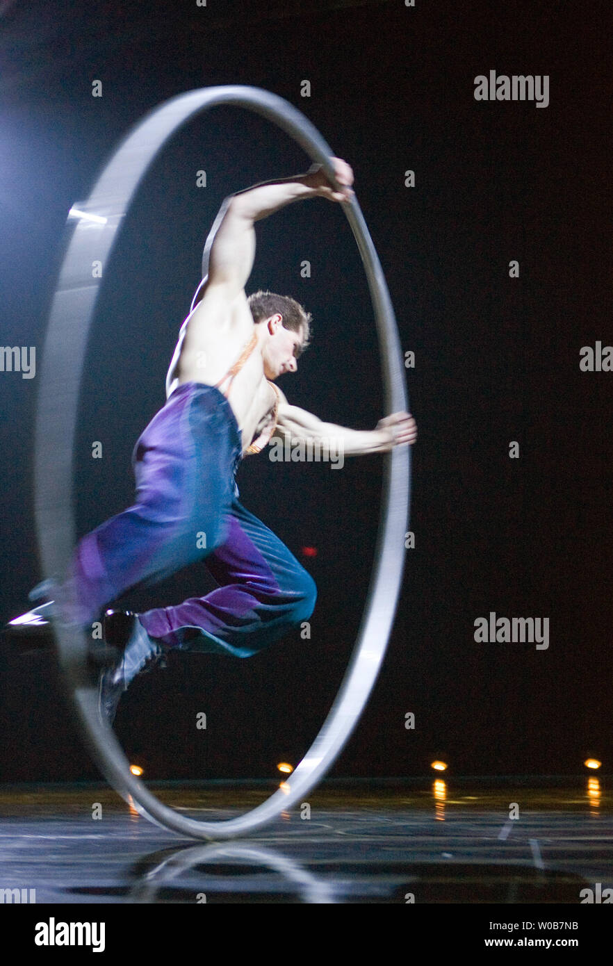 An acrobat performs in the Cyr Wheel routine in Cirque du Soleil's ...