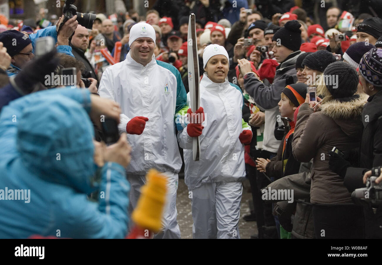 Caleb Taylor (L), 35 and Patricia Moreno, 18, dressed in Torchbearer ...