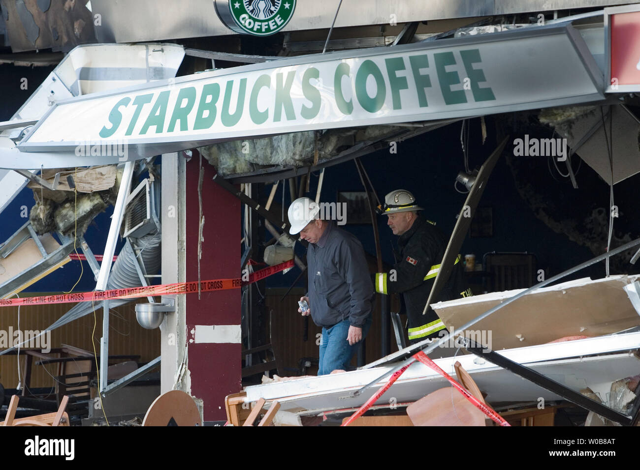 Fire Investigators work the scene of a suspicious early morning gas ...