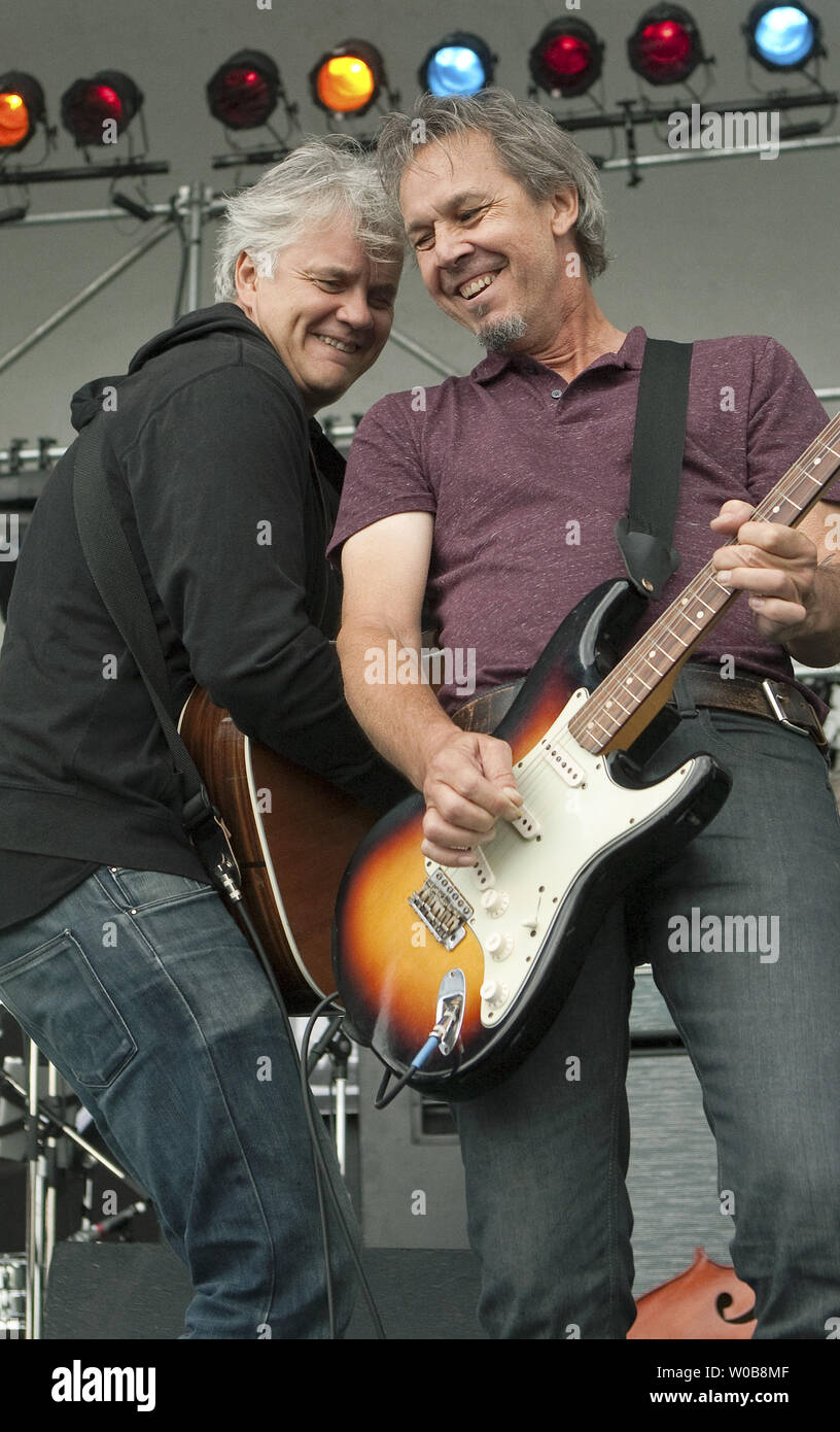 Actor and musician Tim Robbins (L.) plays a guitar duet with his ...