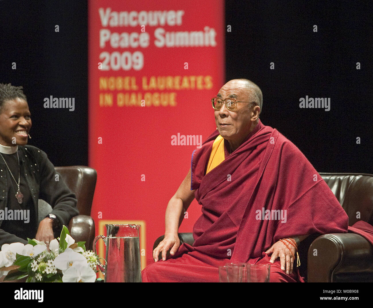 The Dalai Lama arrives onstage with Reverand Mpho Tutu (L) for the 2009 ...