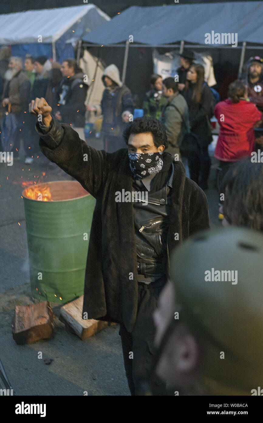 First Nations participants of the "Occupy Vancouver" protest relight a ...