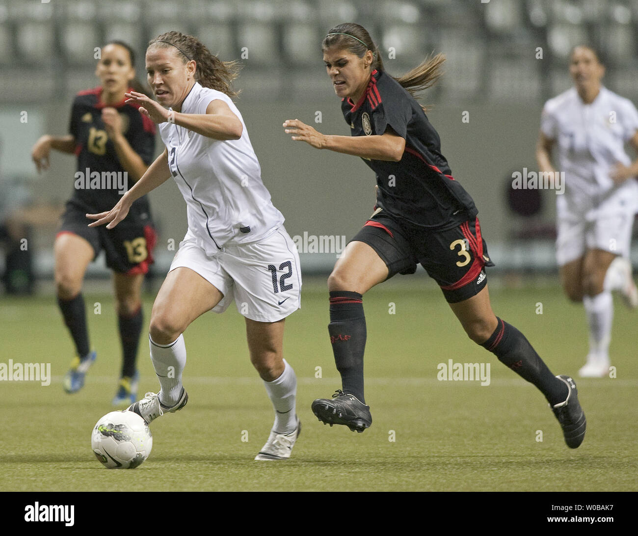 Mexico's Marlene Sandoval chases the USA's Lauren Cheney during the ...