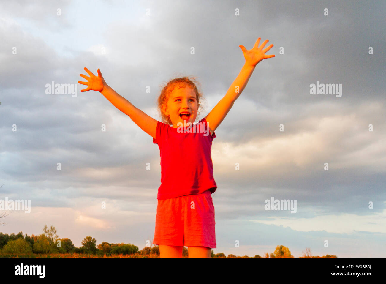Girl with open arms hi-res stock photography and images - Alamy