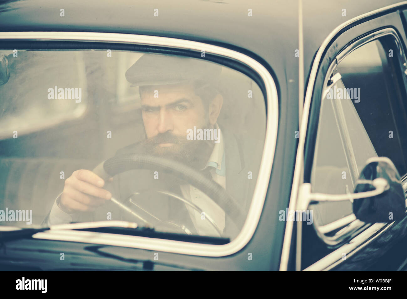 driver man in car. driver with beard in retro car Stock Photo - Alamy