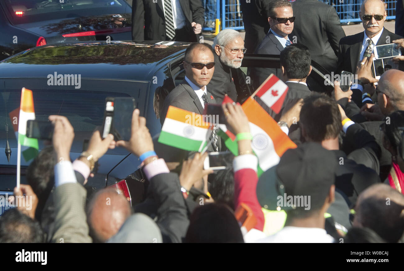 India's Prime Minister Narendra Modi exits his vehicle as he arrives at ...