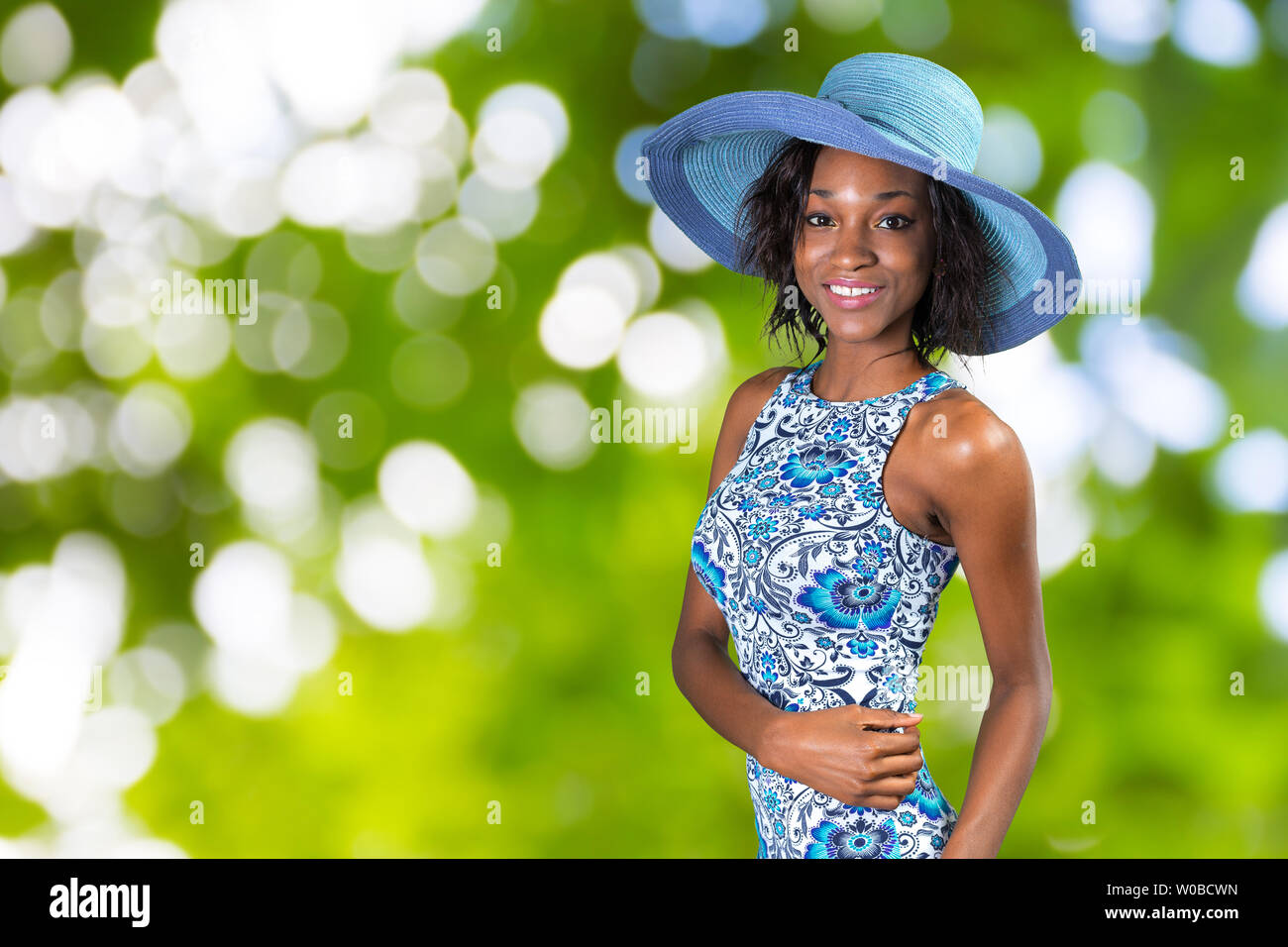 Beautiful young South African woman in blue Stock Photo - Alamy