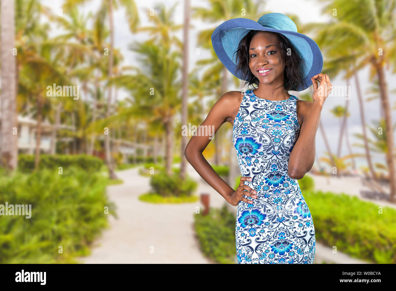 Beautiful young South African woman in blue Stock Photo - Alamy