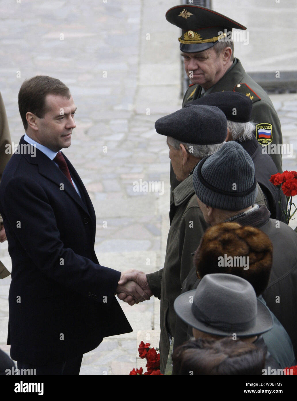 Russian President Dmitry Medvedev (L) greets World War Two veterans ...
