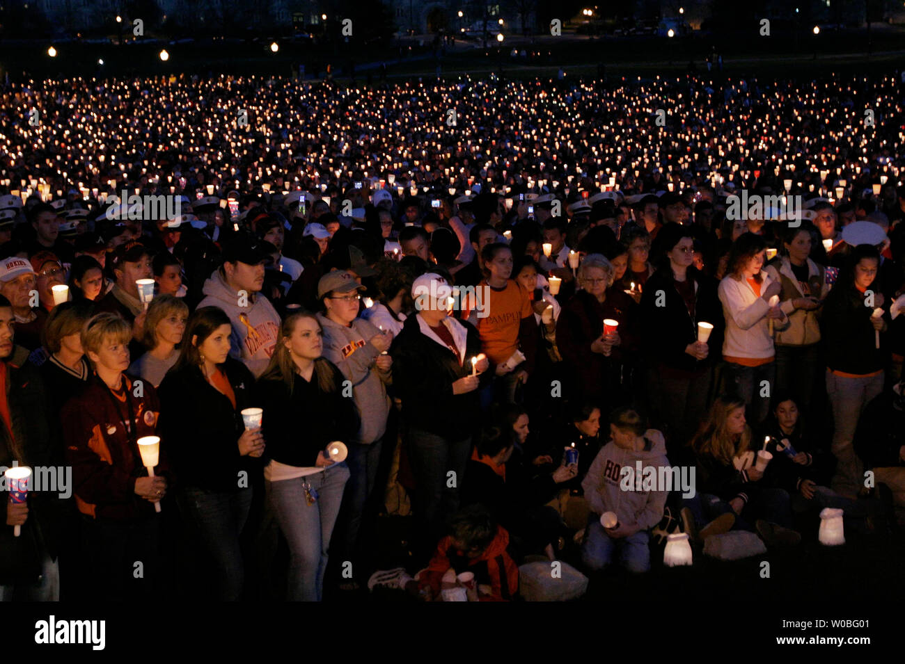 Virginia Tech students attend a candlelight vigil for the 33 people who ...