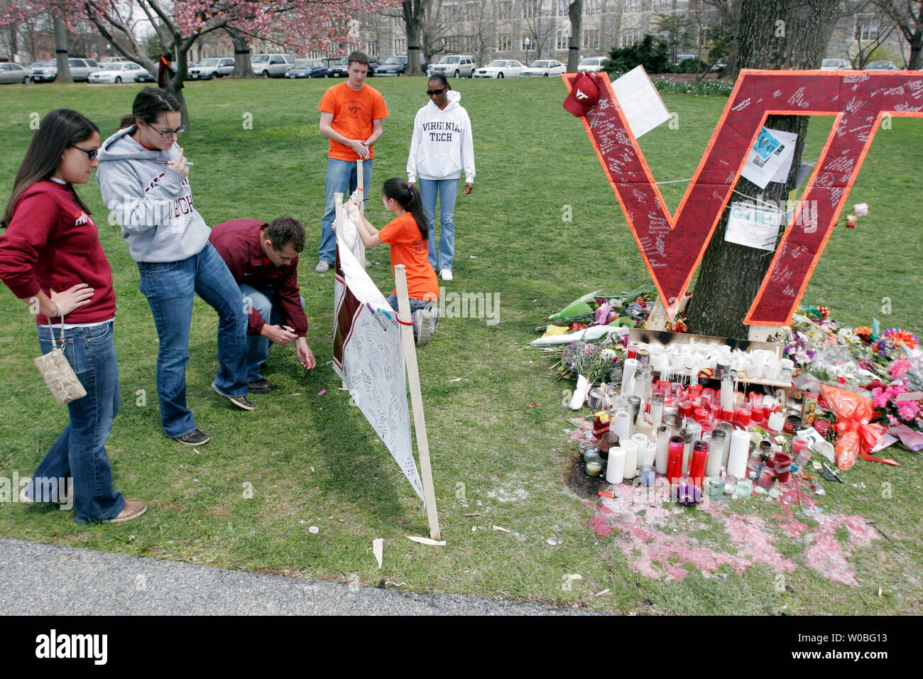 Virginia Tech students visit a memorial for the 33 students who died in ...