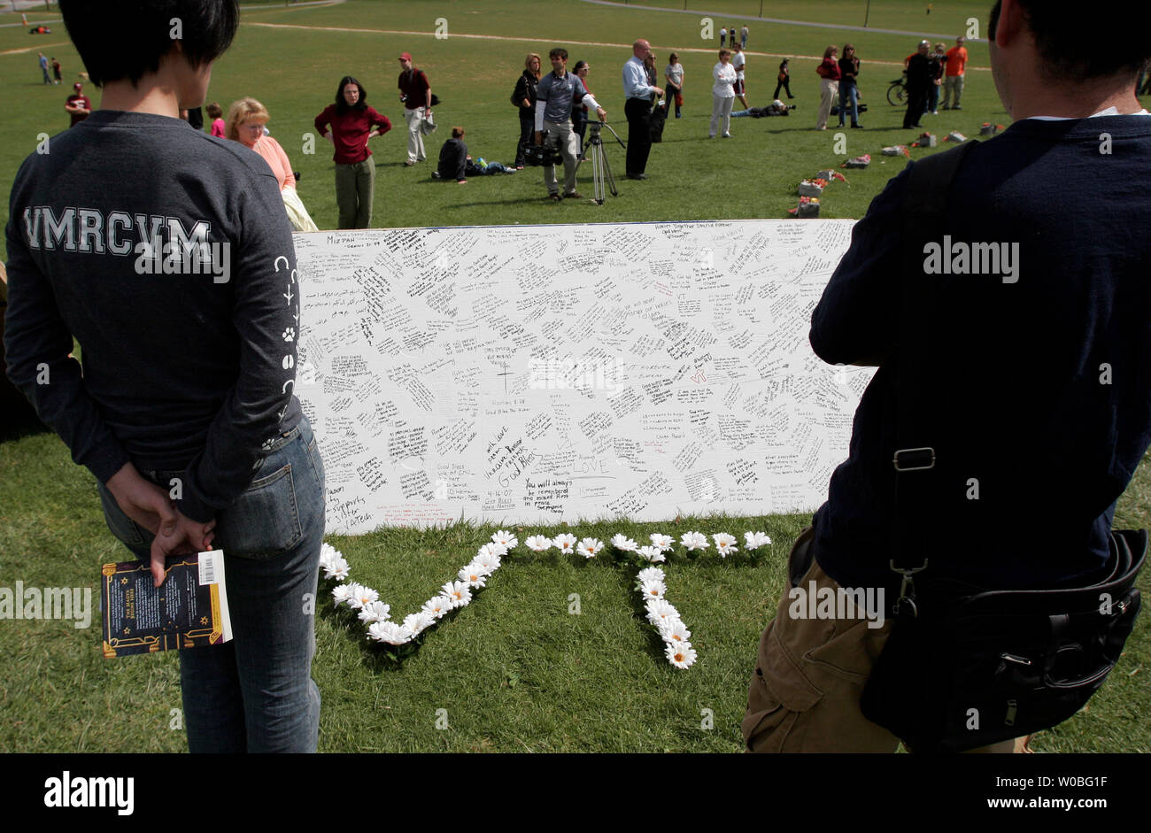Virginia Tech students visit a memorial for the 33 students who died in ...