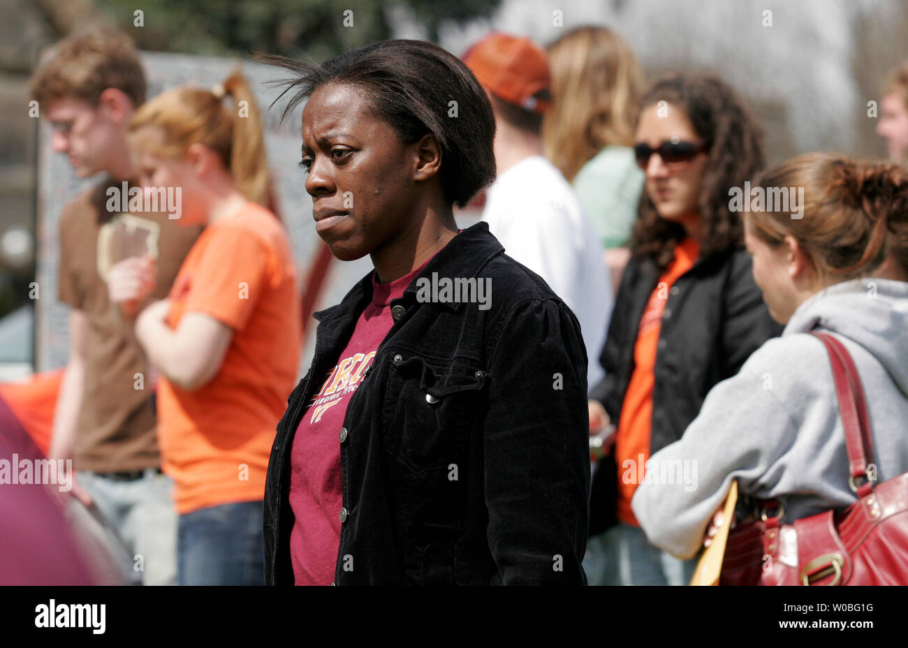 Virginia Tech students visit a memorial for the 33 students who died in ...