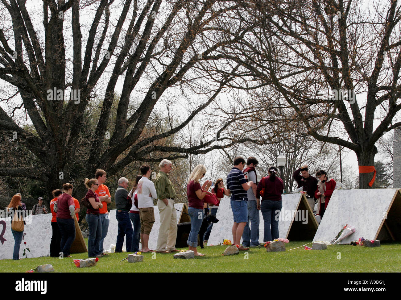 Virginia Tech students visit a memorial for the 33 students who died in ...