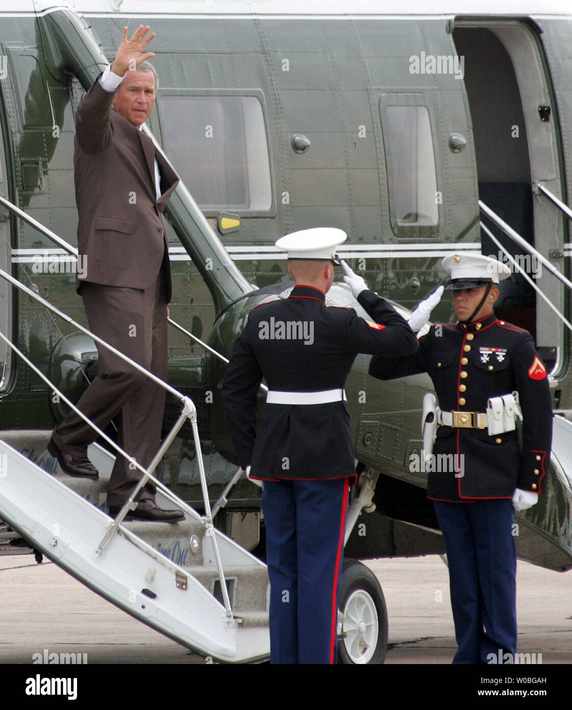 U.S. President George W. Bush arrives at the airport in Waco, Texas, en ...