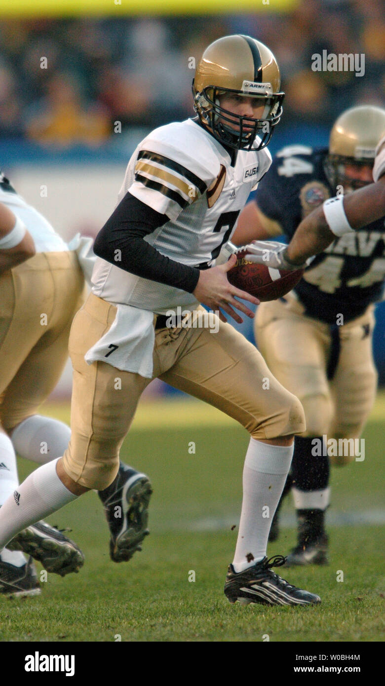 Quarterback Zac Dahman of the Army hands off in the annual Army Navy ...