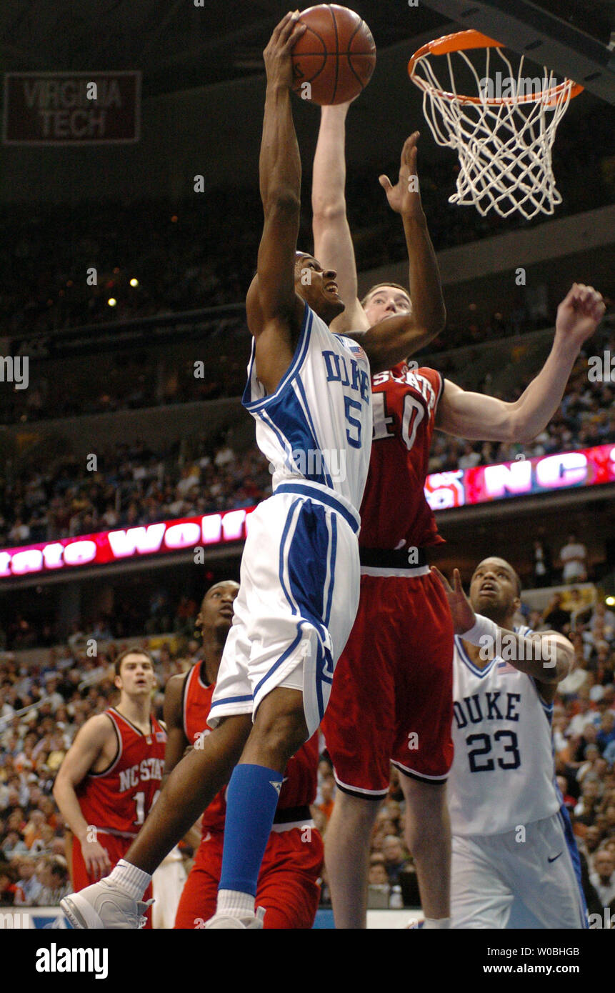 Daniel Ewing of the Duke University Blue Devils scores 2 of his 14 ...