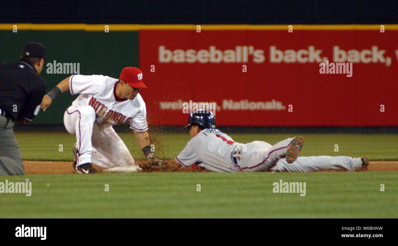 The Washington Nationals Jose Vidro tags out the Atlanta Braves Rafel ...