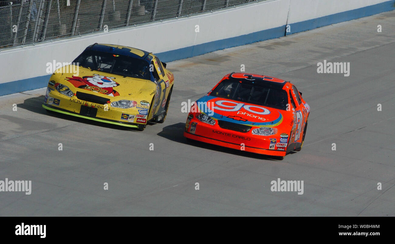 Kyle Busch in the Number 5 car moves overtakes Jeff Burton in the ...