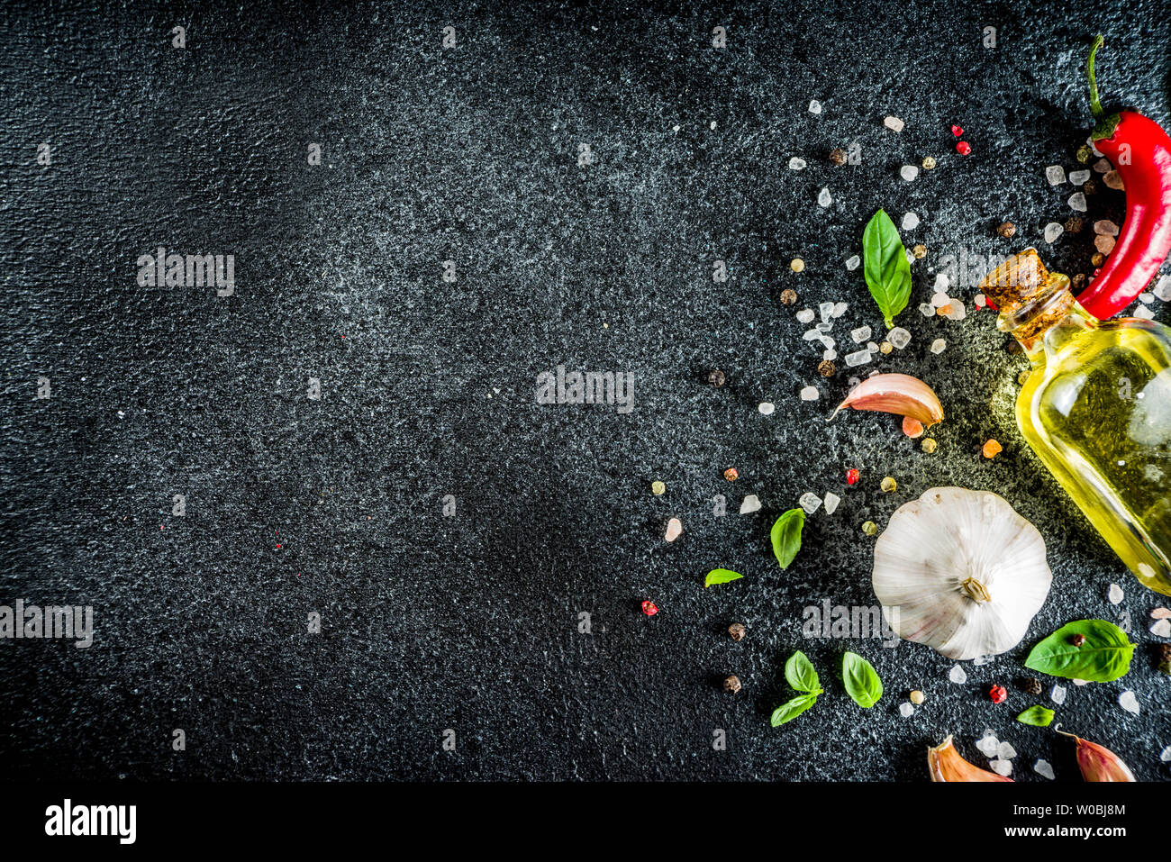 Cooking food stone concrete background with spices, olive oil, garlic ...